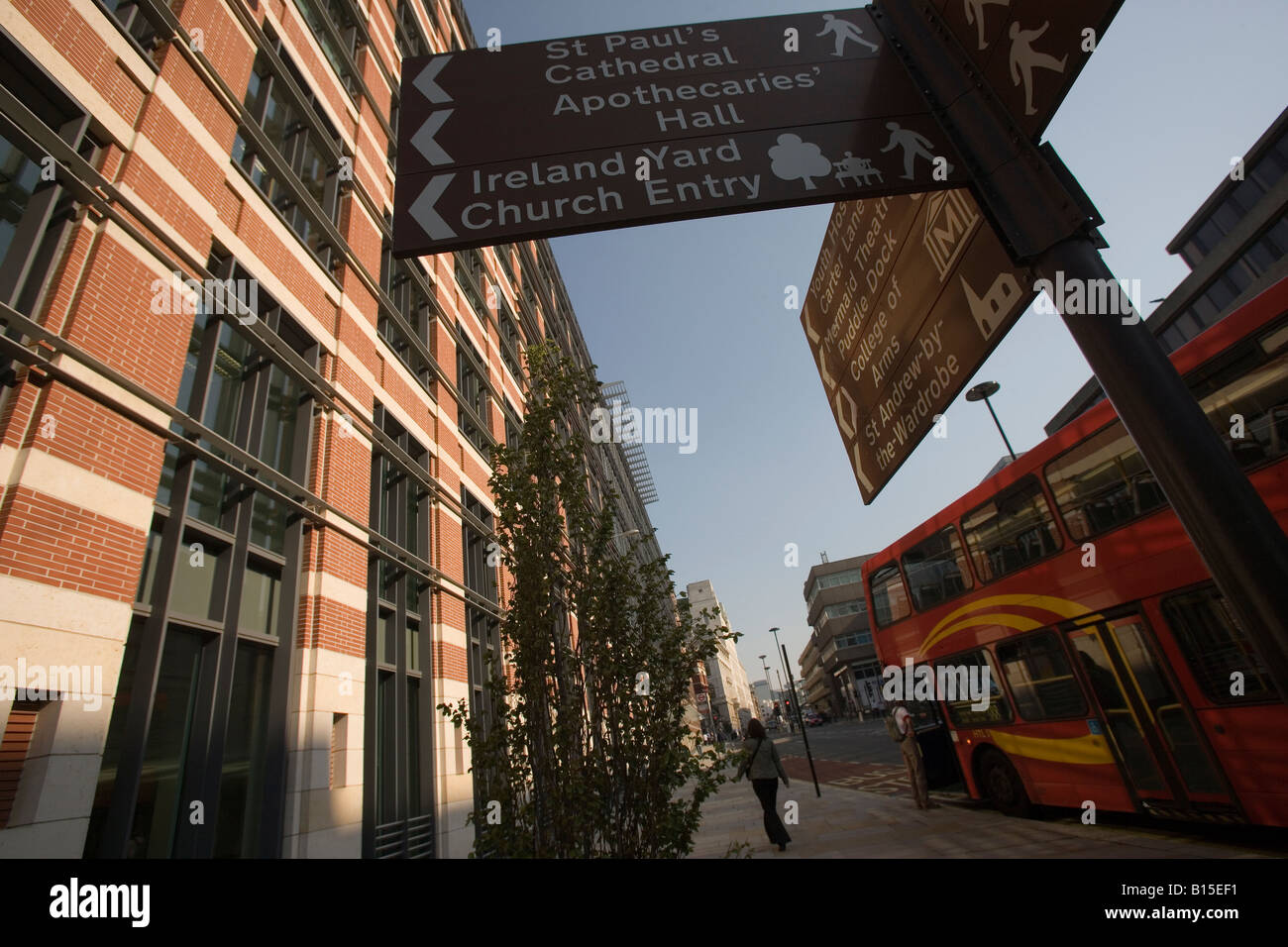 A street sign situated by the exterior of a newly constructed office ...