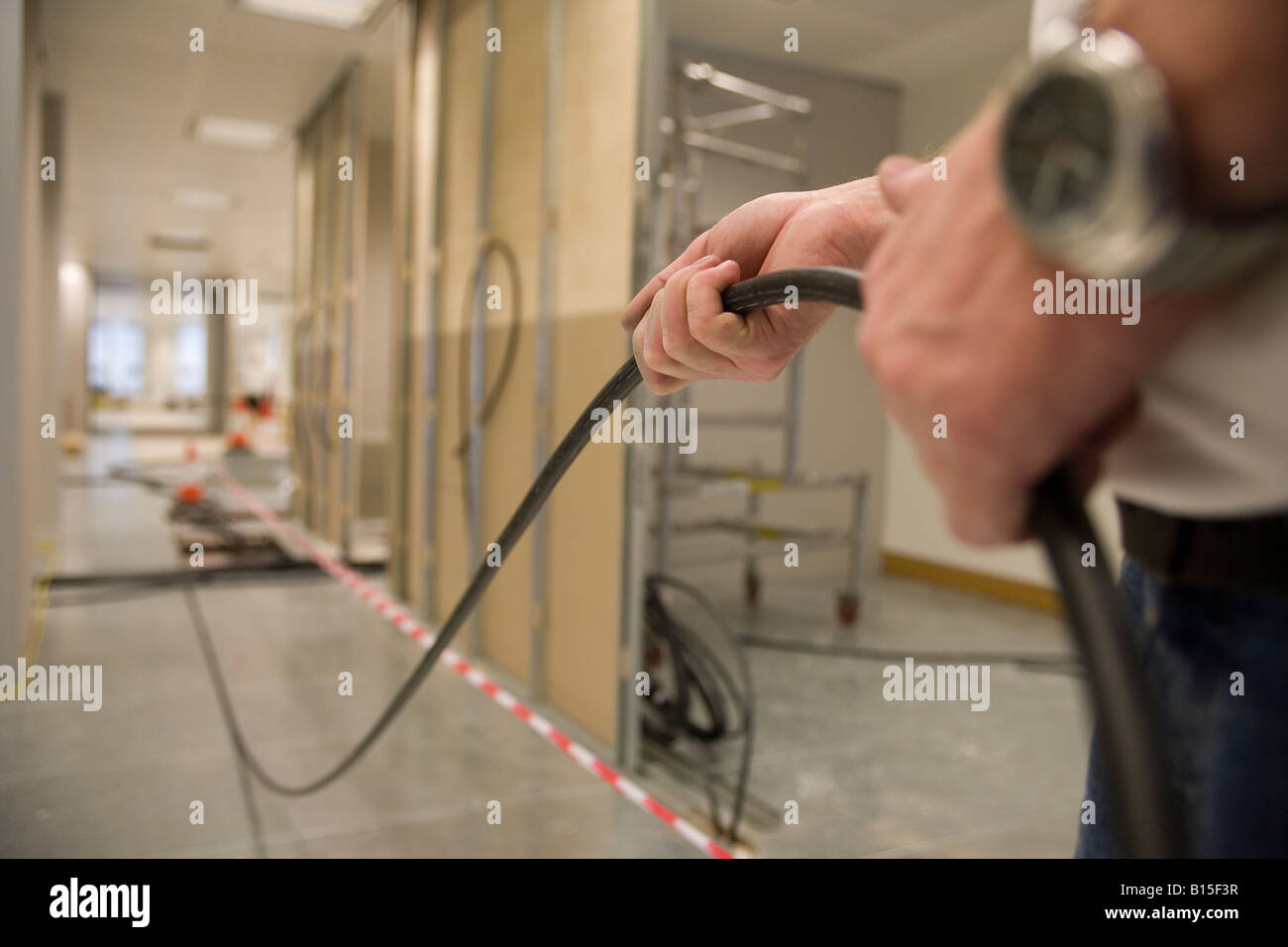 Cable engineer installing mains work hi-res stock photography and ...
