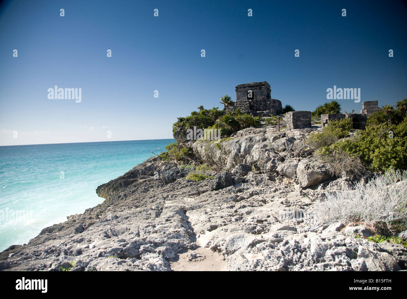 Mayan temples sit upon a cliff top overlooking the sea at Tulum in ...
