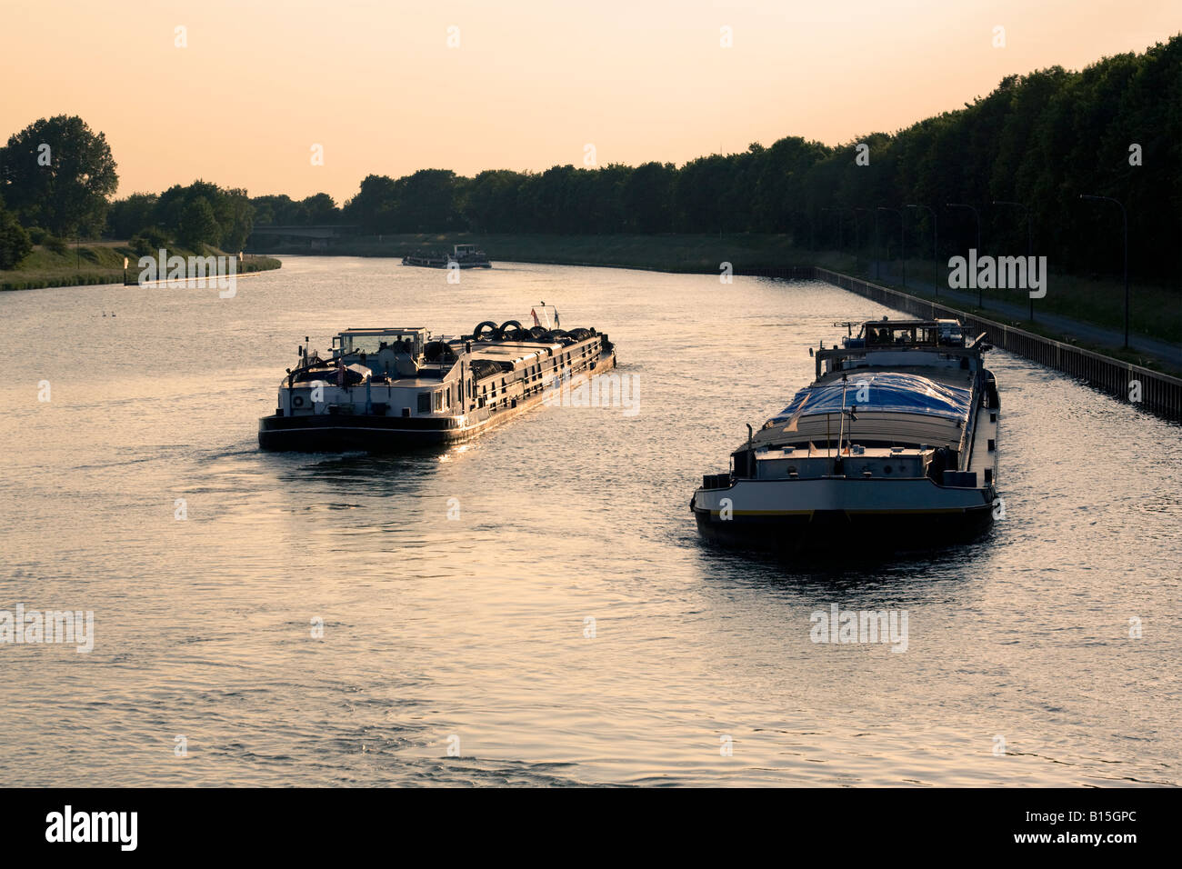 Cargo ships manoeuvering on Wesel-Datteln Canal, at sunset Stock Photo - Alamy