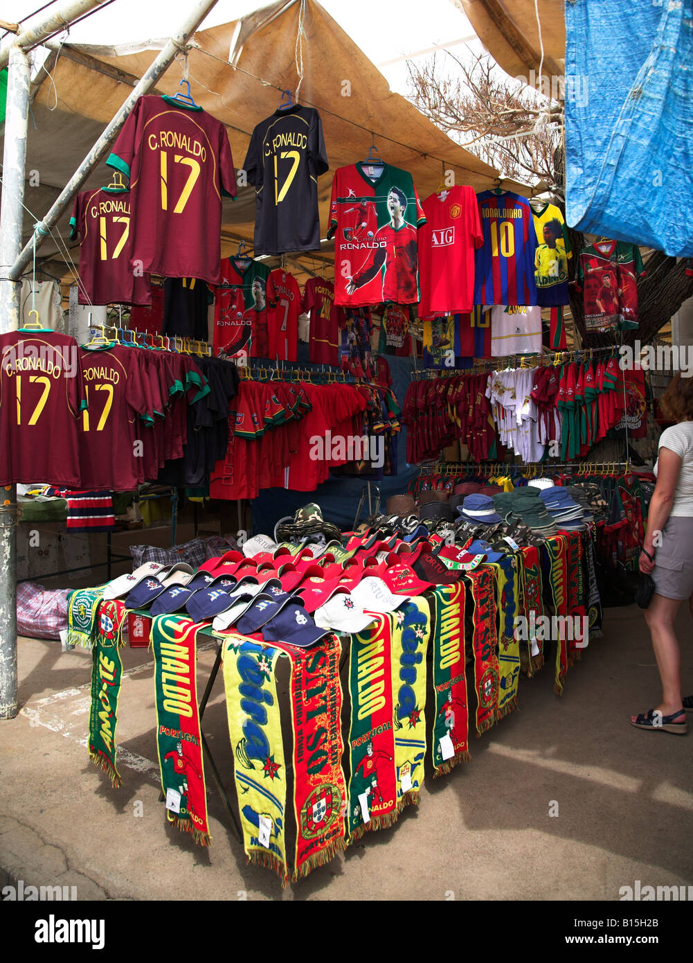 Market stall selling football clothing Stock Photo - Alamy