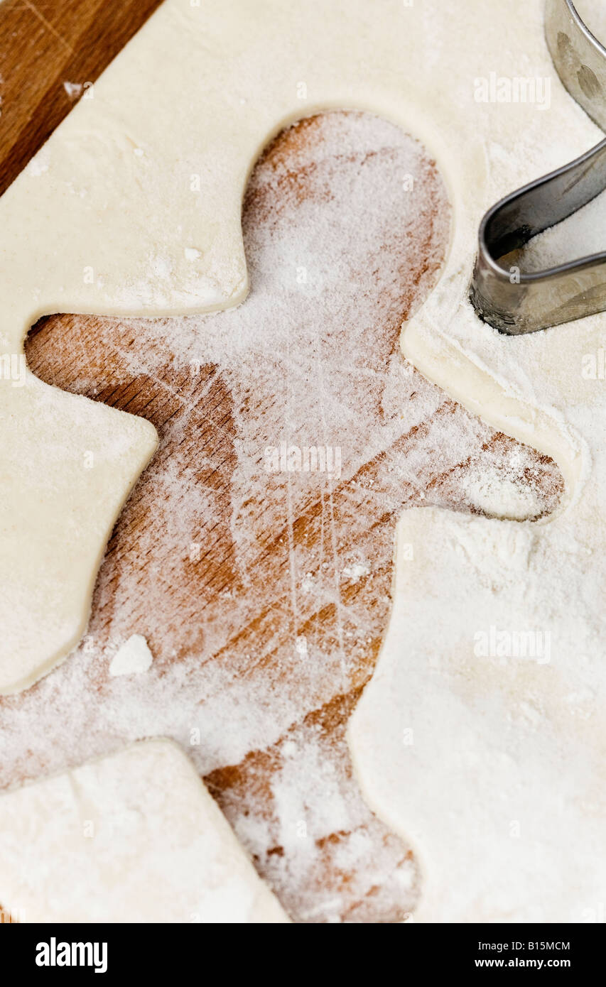Raw pastry with gingerbread man cutter Stock Photo - Alamy