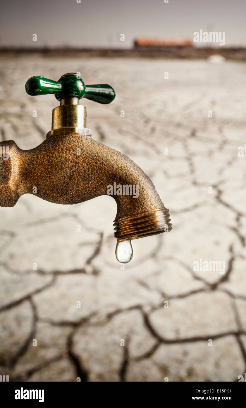 water faucet dripping water with dried earth in the background Stock ...