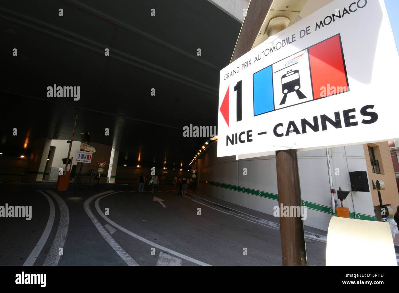 Street sign at Monaco Grand Prix with people in the background walking ...