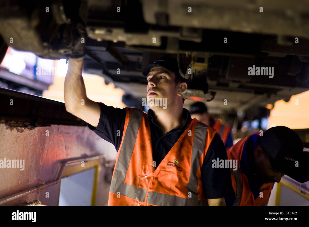 A Metronet engineer works on maintaining tube trains at Hainault depot ...