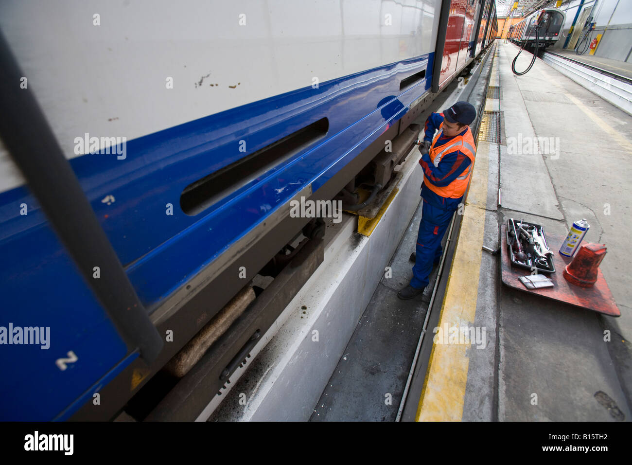 A Metronet engineer works on maintaining tube trains at Hainault depot ...