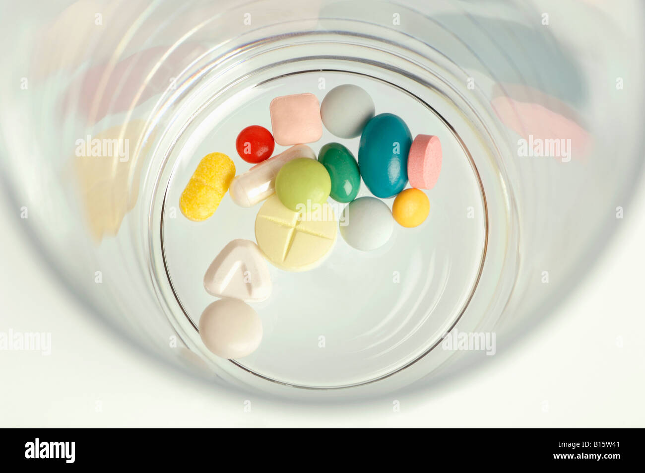 Pills in a bowl, close-up Stock Photo - Alamy