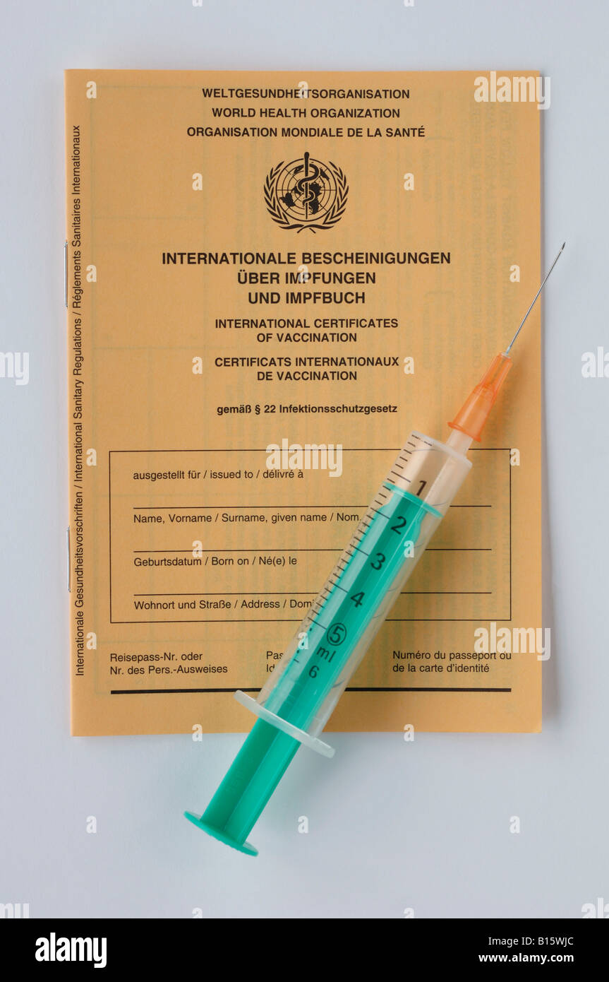 Syringe on vaccination card, close-up Stock Photo - Alamy