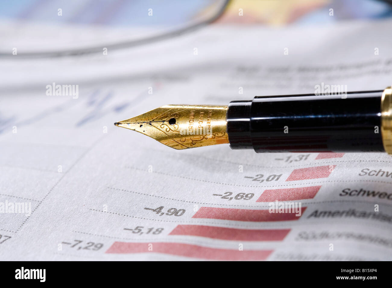 Pen on newspaper, close-up Stock Photo - Alamy