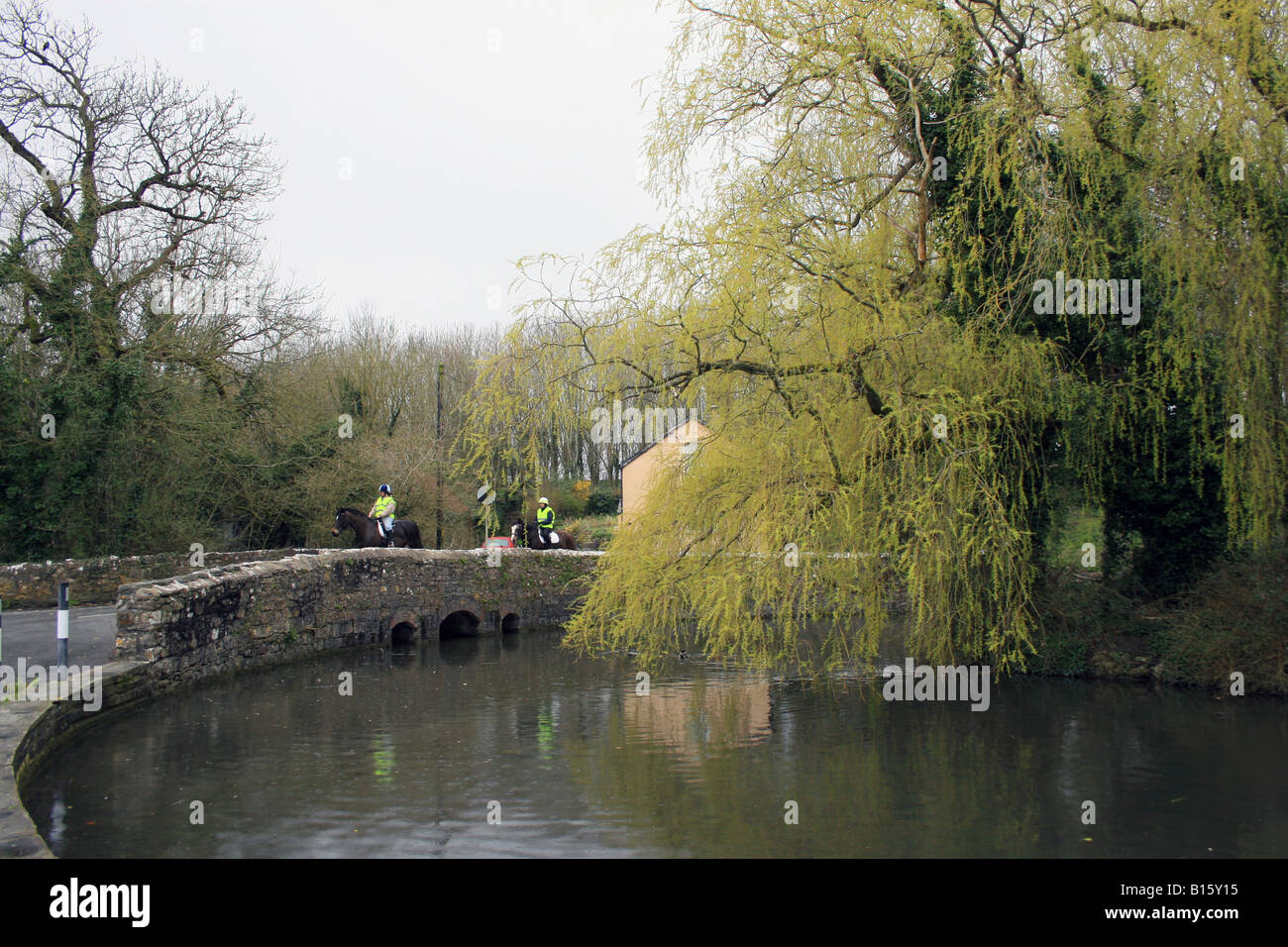 Horse Riders on Road Village Pond Fonmon Stock Photo - Alamy