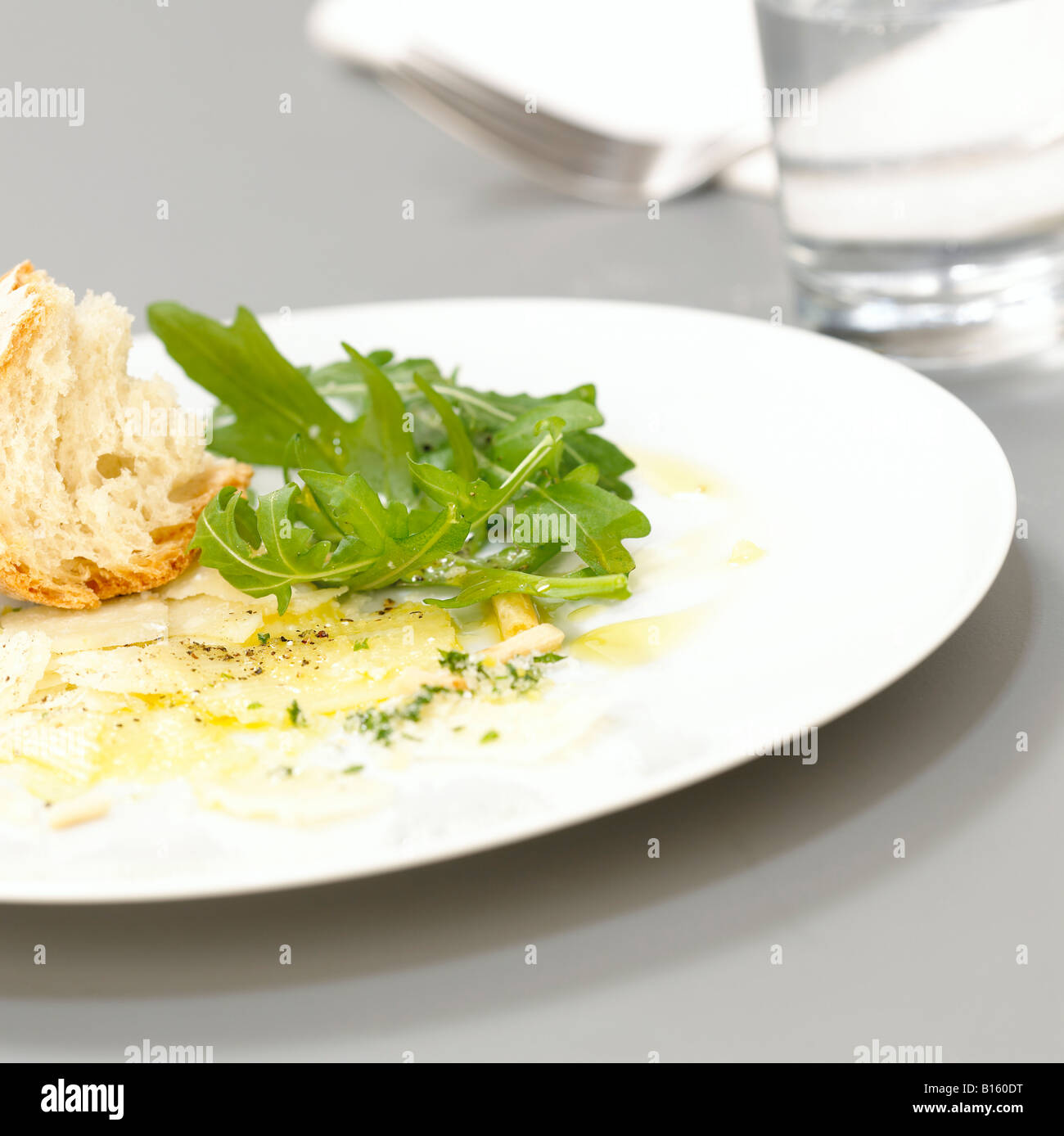 Rocket salad with Parmesan cheese, close-up Stock Photo - Alamy