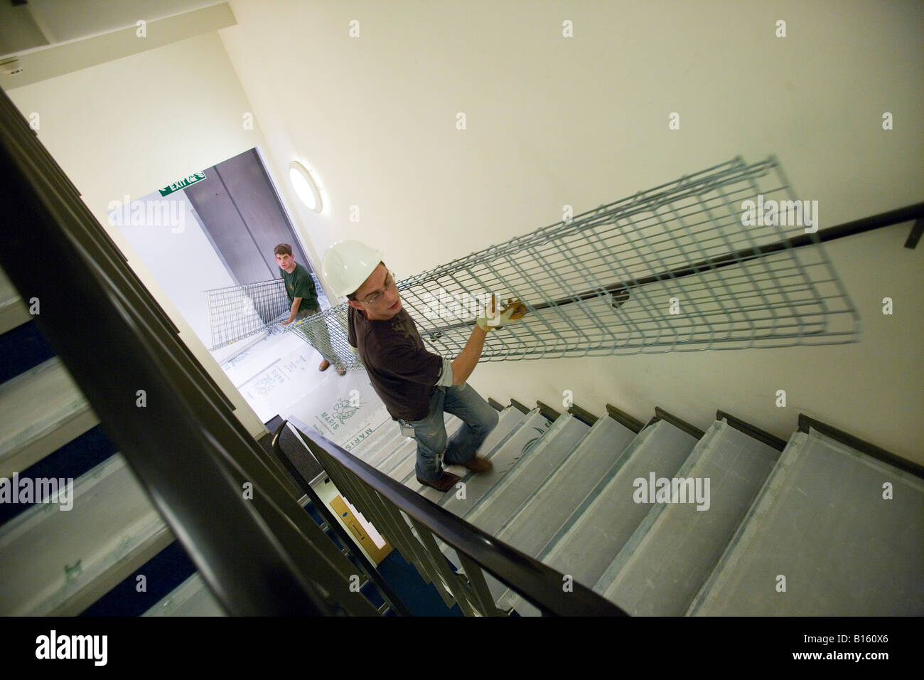 Builder carry lift stairs work hi-res stock photography and images - Alamy