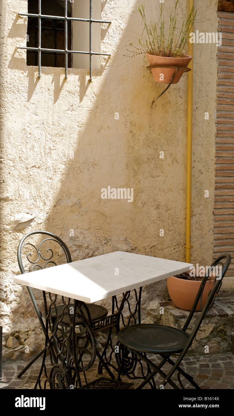 table outside with window italian style Stock Photo - Alamy