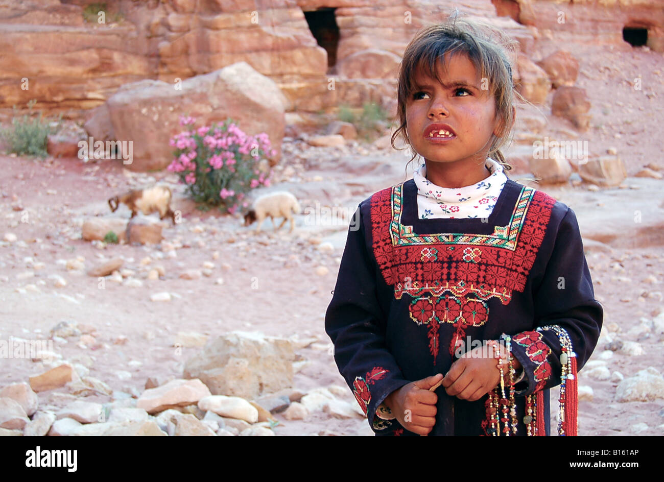 A young Bedouin girl sells jewelry to passers-by in Petra, Jordan ...