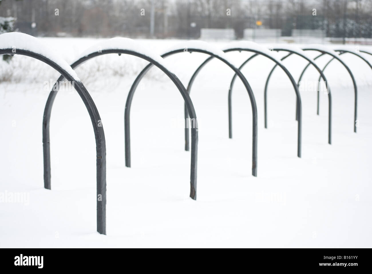 A snow covered bike rack in winter Stock Photo - Alamy