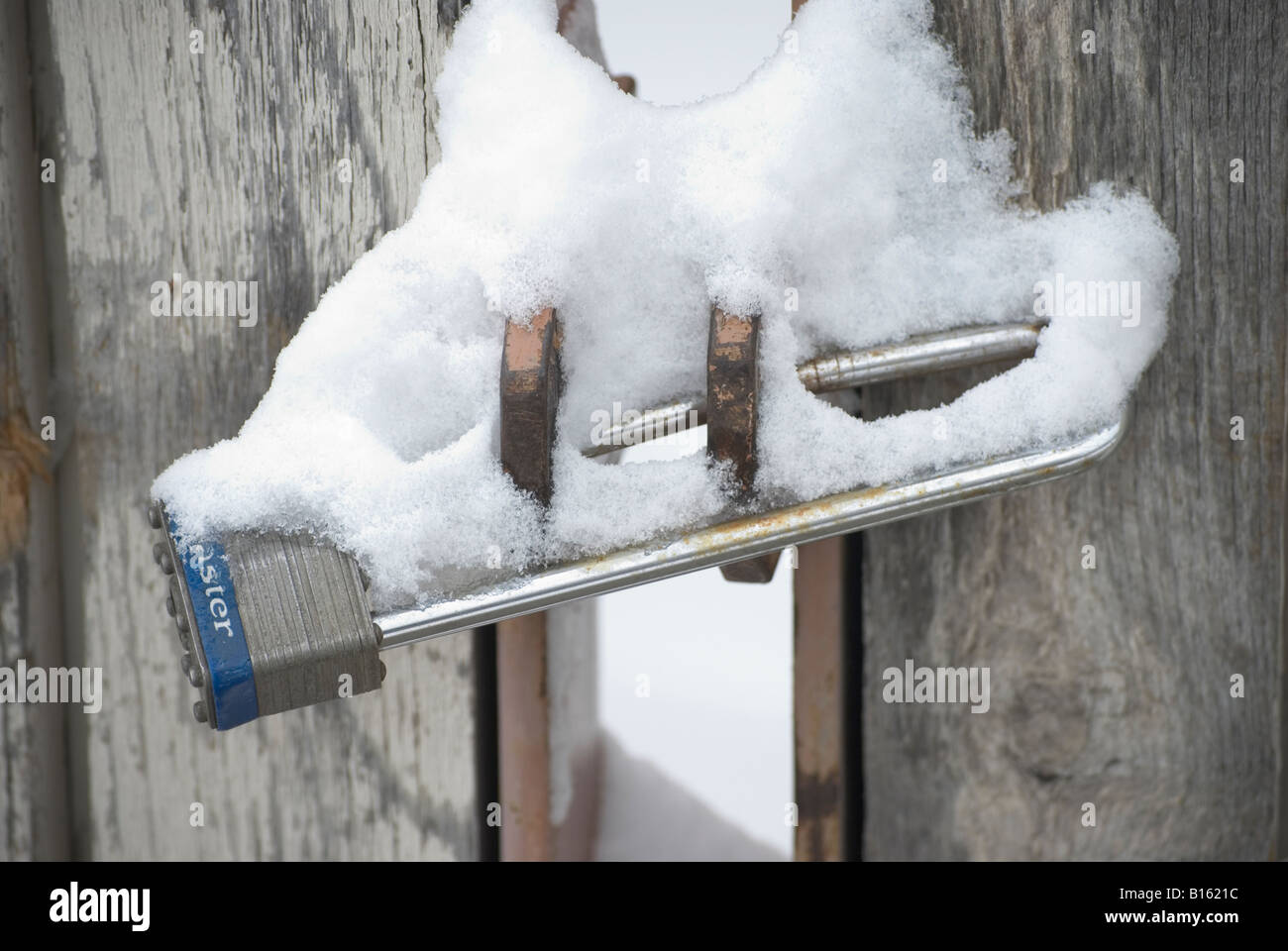 A padlock is covered in snow after a big winter storm Stock Photo - Alamy