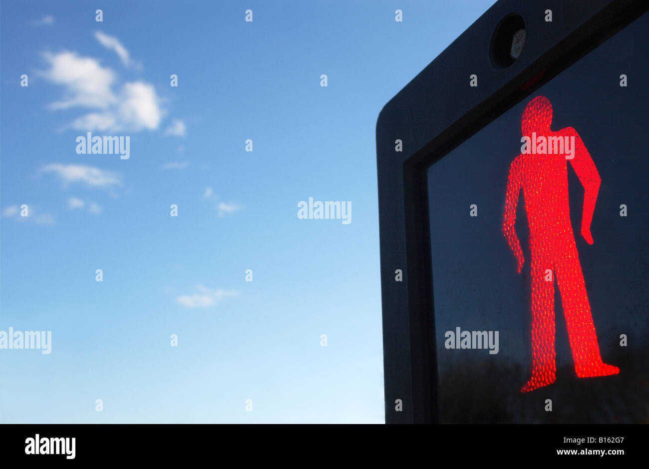 Do not cross illuminated pedestrian warning sign Stock Photo - Alamy