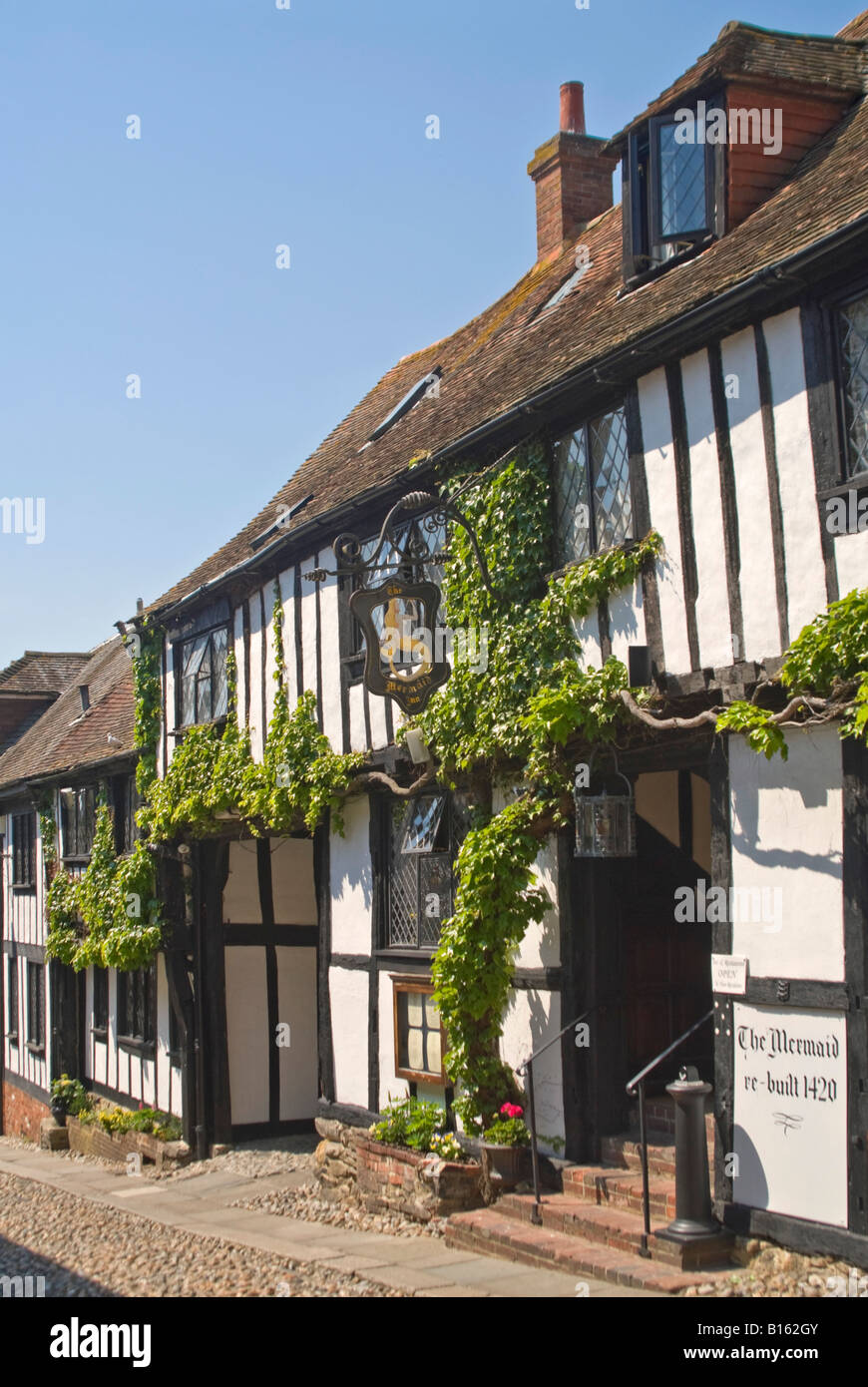 Vertical wide angle view of the traditional Tudor cottages along a ...