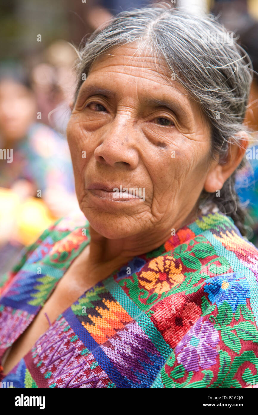 An elderly Mayan woman wearing traditional clothing woven by hand by ...
