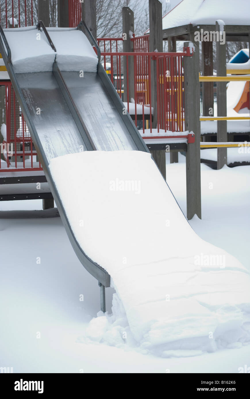 A slide in a community park is covered in snow after a major winter ...