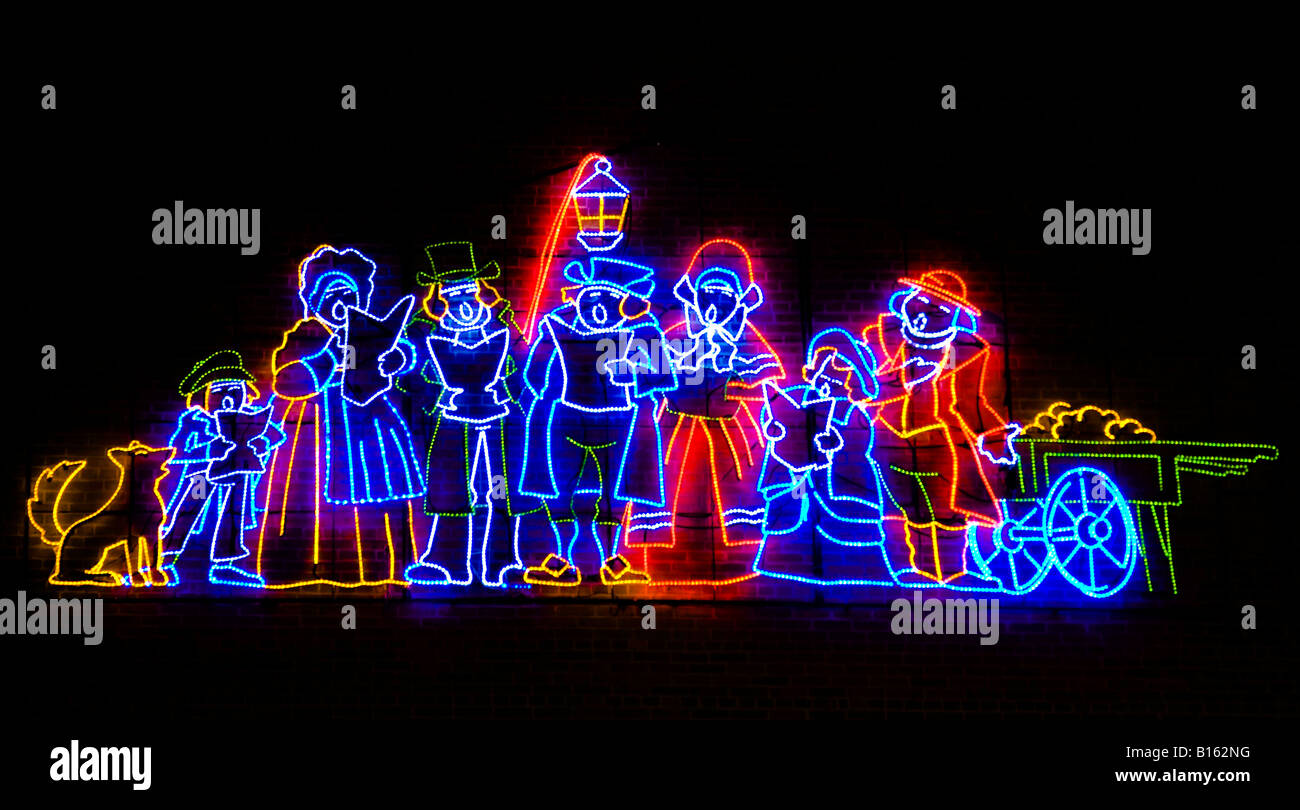 Christmas carol neon sign at night Stock Photo - Alamy