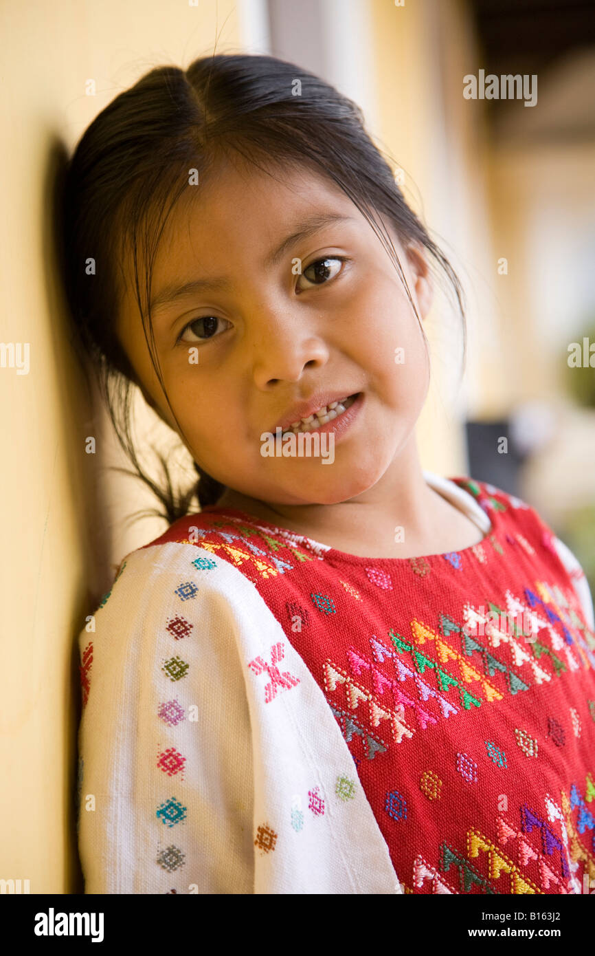 An eyoung Mayan child wearing traditional clothing woven by hand by ...