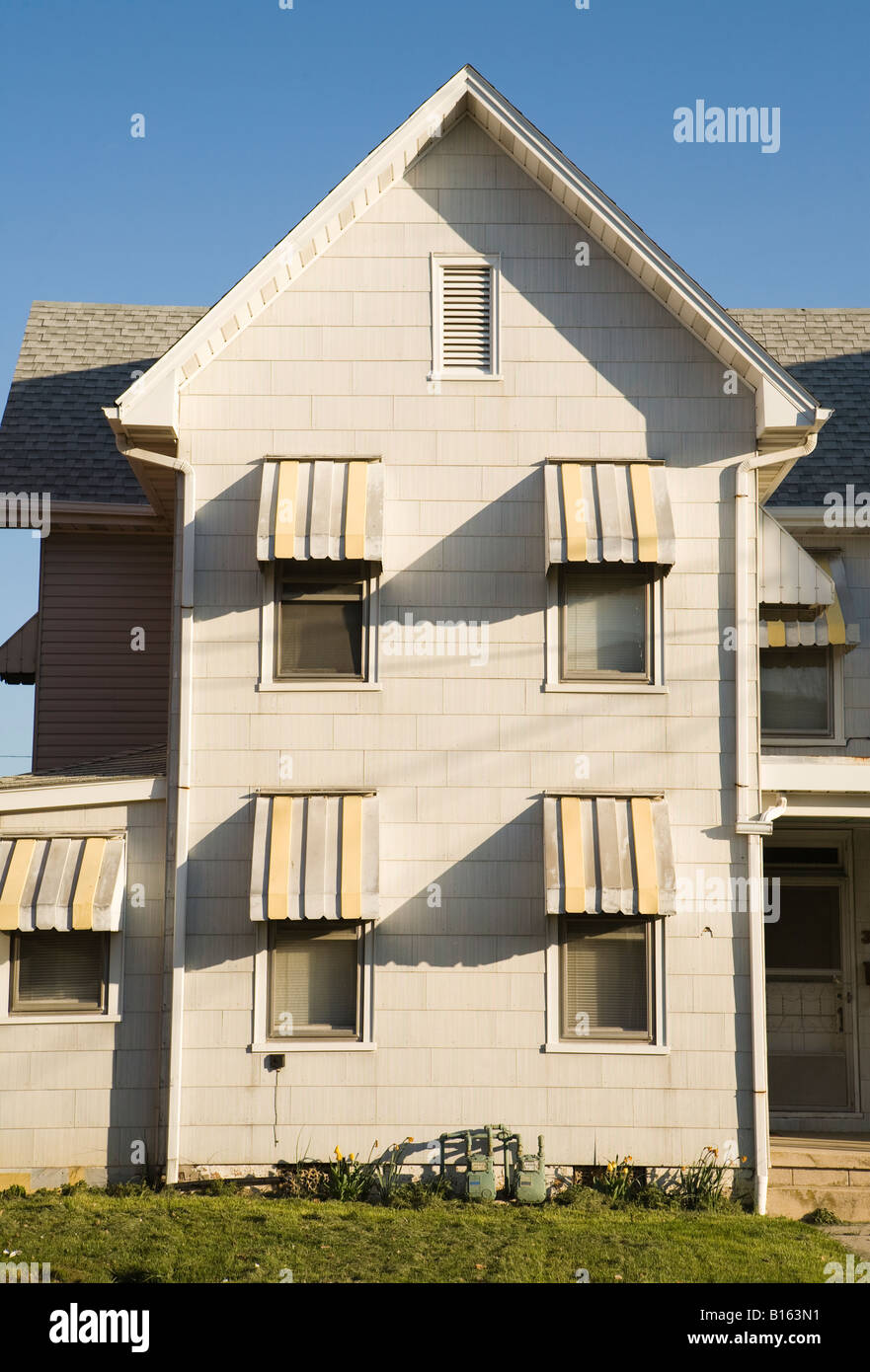 House with window awnings Stock Photo - Alamy