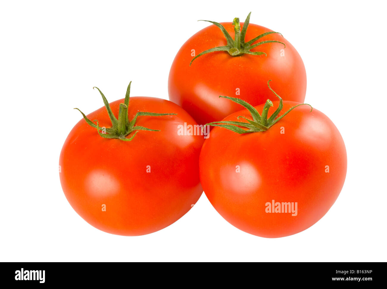 three full tomatoes isolated on white background Stock Photo - Alamy