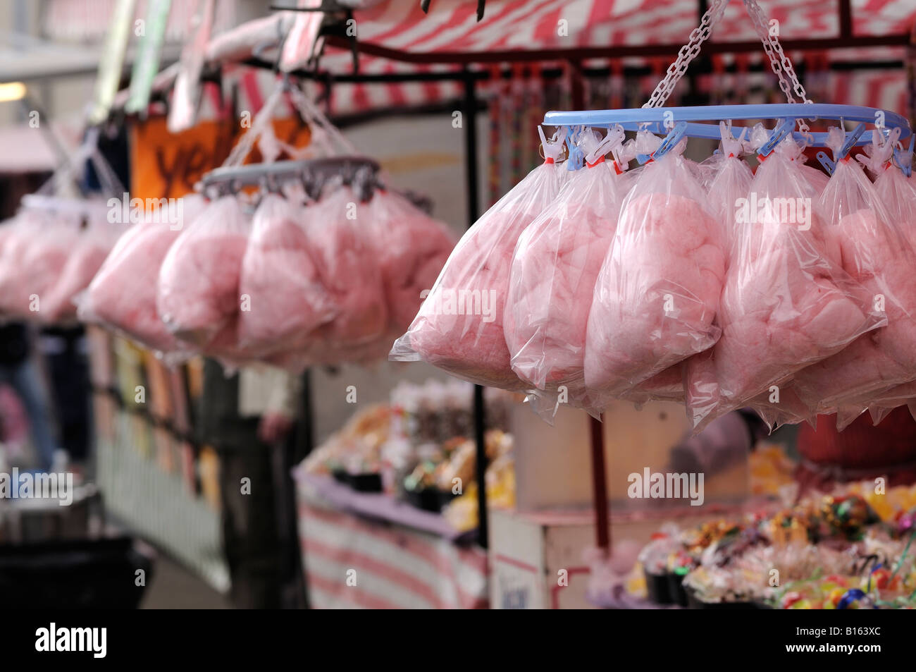 Bags of Candy Floss hanging at Stall Stock Photo - Alamy