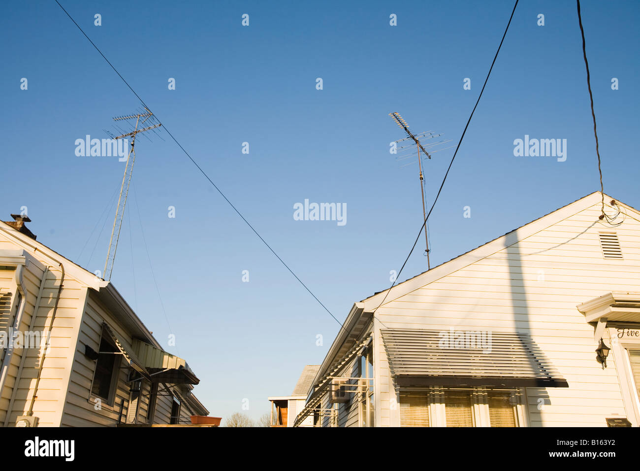Top of a house with telephone wires Stock Photo - Alamy