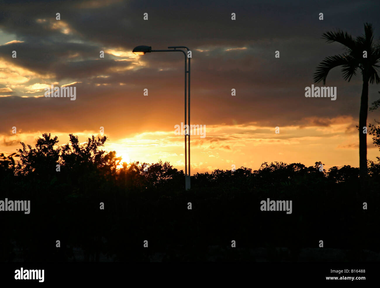 sunset street lights Stock Photo - Alamy