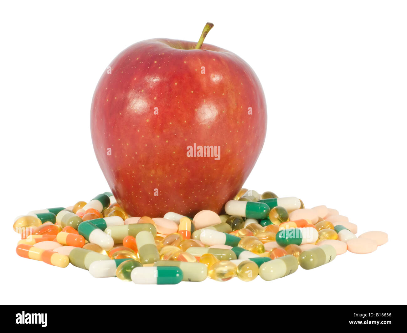 Red apple vs. food supplements in pills Stock Photo - Alamy
