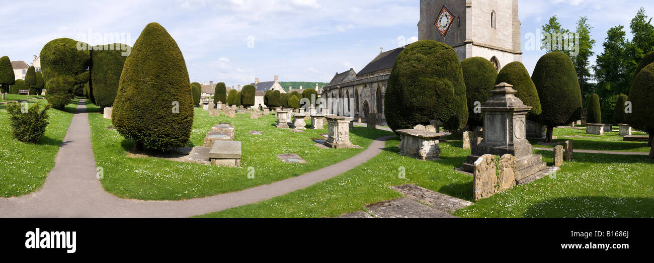 Carved stone tombs and some of the 99 yew trees in the churchyard of ...