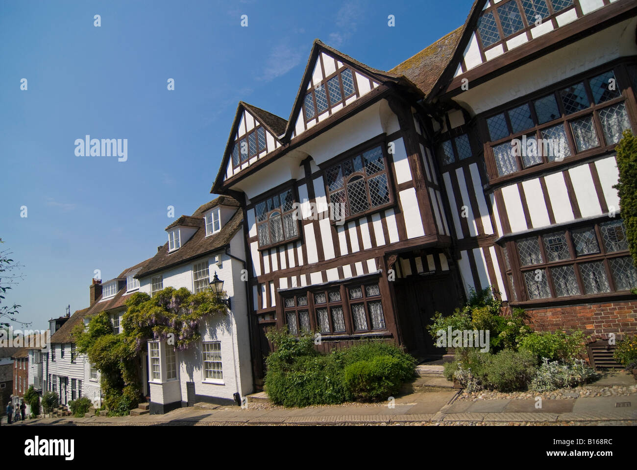 Horizontal wide angle view of the traditional Tudor cottages along a ...