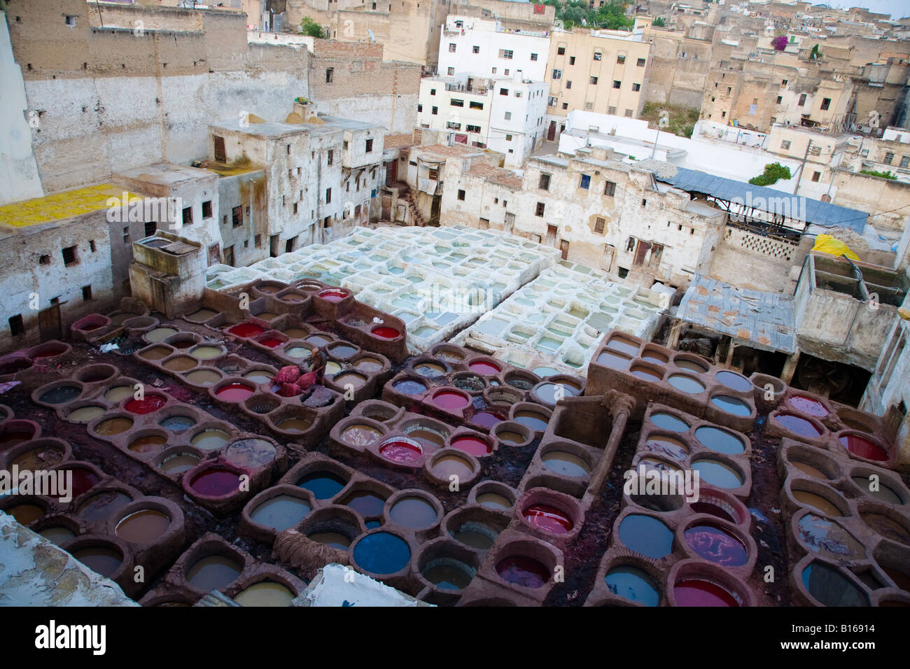 Containers of dye at a tannery in Fez Morrocco Stock Photo - Alamy