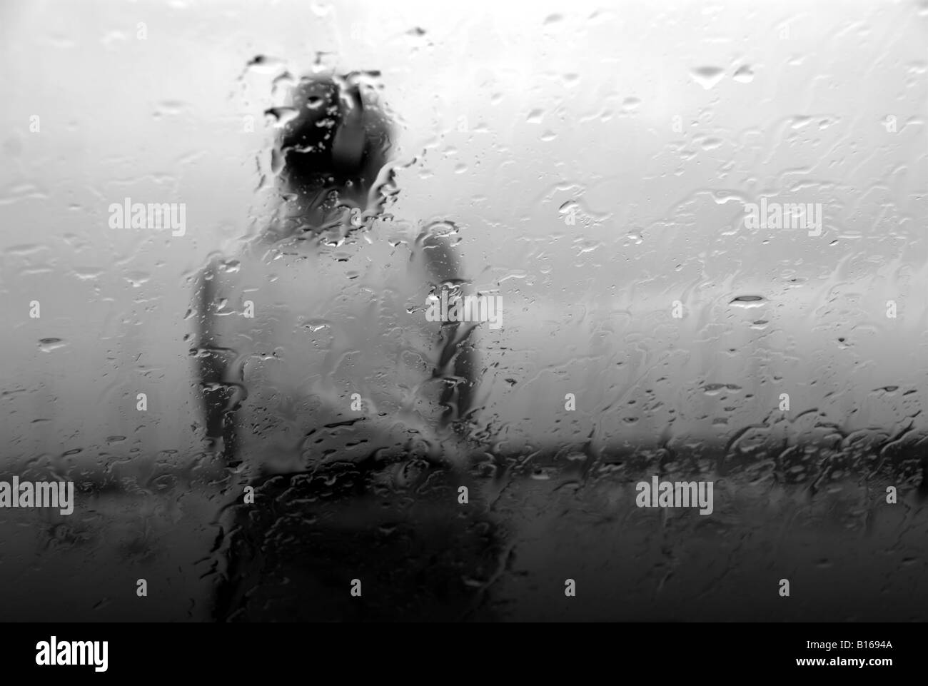 Woman sad window Black and White Stock Photos & Images - Alamy