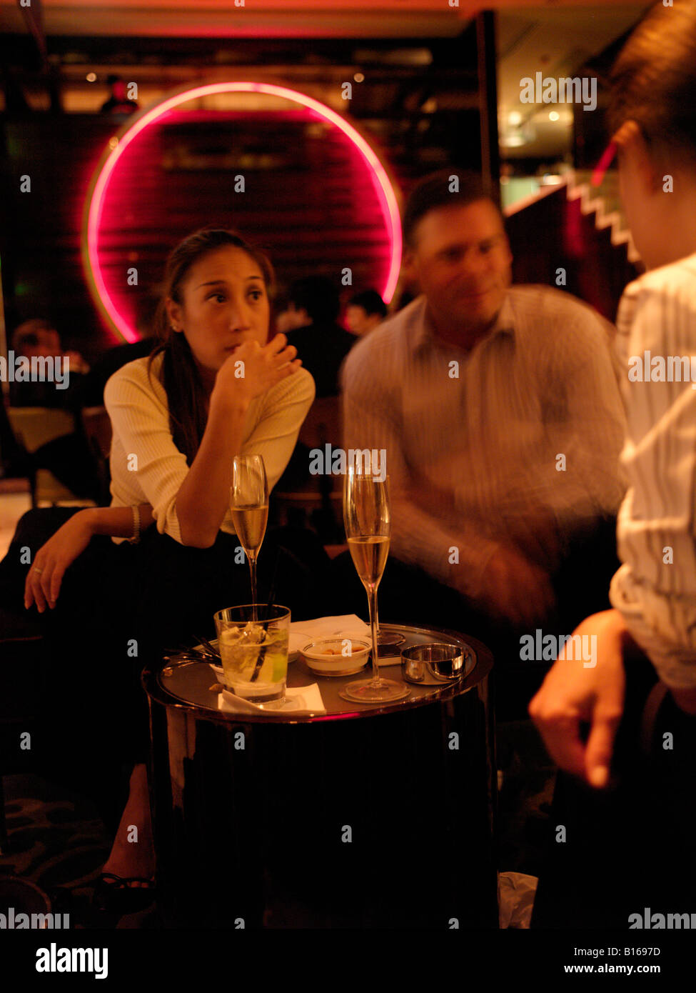 Guest enjoying drinks at MO Bar in the Landmark Mandarin Oriental Hotel ...