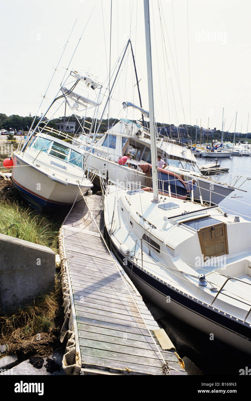 Damaged boats washed ashore in harbor after hurricane Stock Photo - Alamy