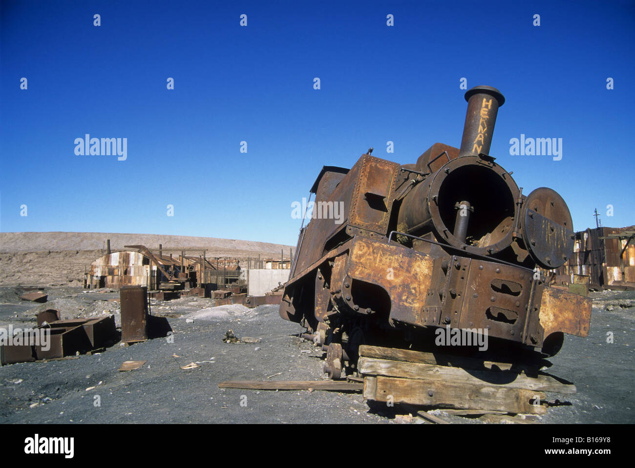 Rusting train in the abandoned mining town of Humberstone, near Iquique ...