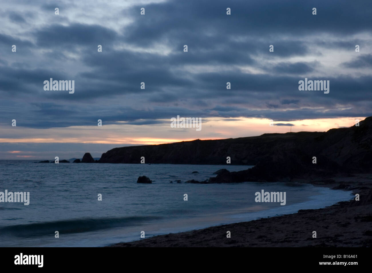 Quiet lapping waves at sunset hi-res stock photography and images - Alamy