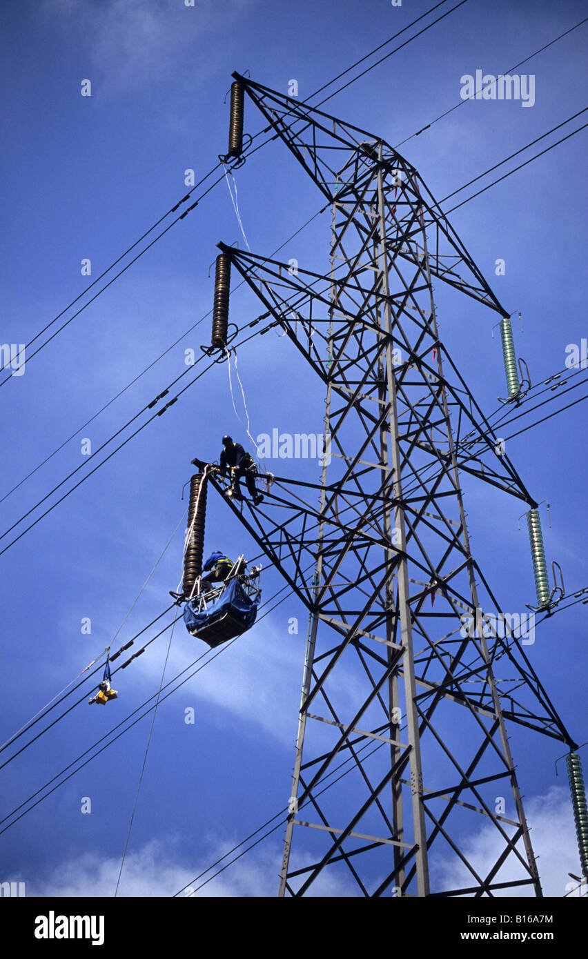 Engineers Working On Electric Power Pylons And Cables Stock Photo - Alamy