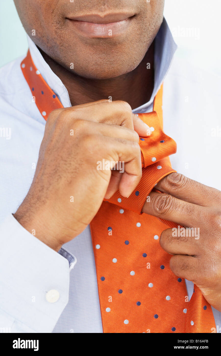 African American man tying necktie Stock Photo - Alamy