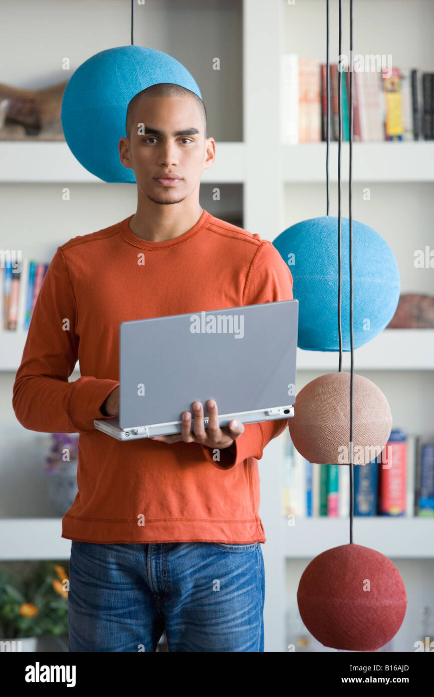 African American man holding laptop Stock Photo - Alamy