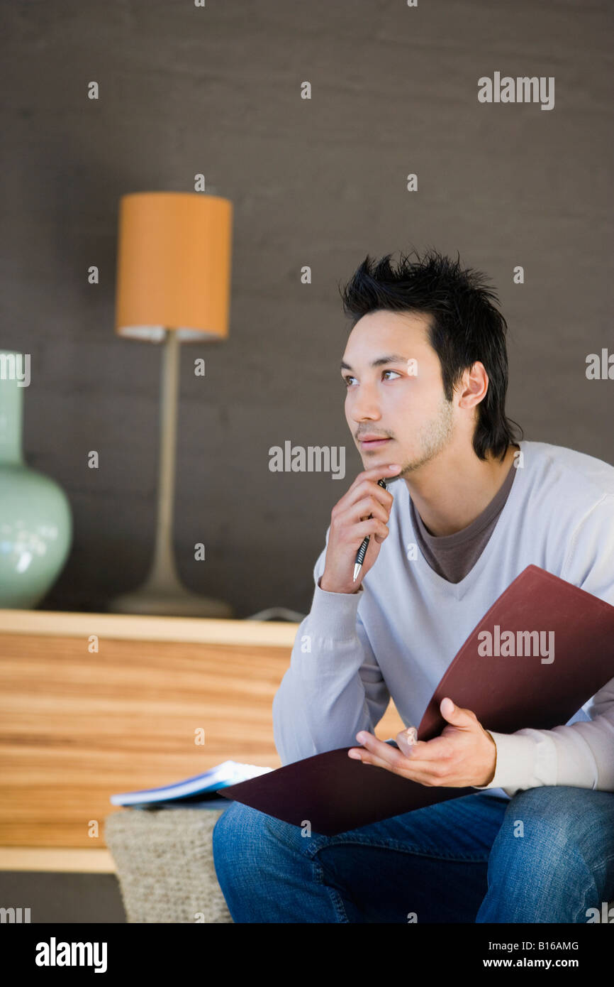 File chinese man holding hi-res stock photography and images - Alamy