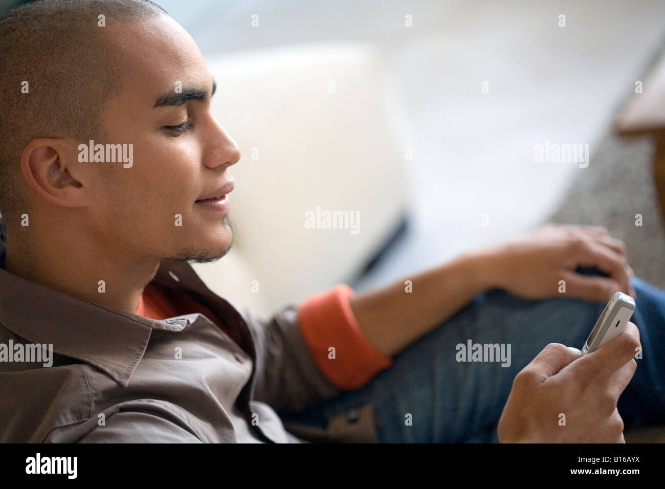 African American man dialing cell phone Stock Photo - Alamy