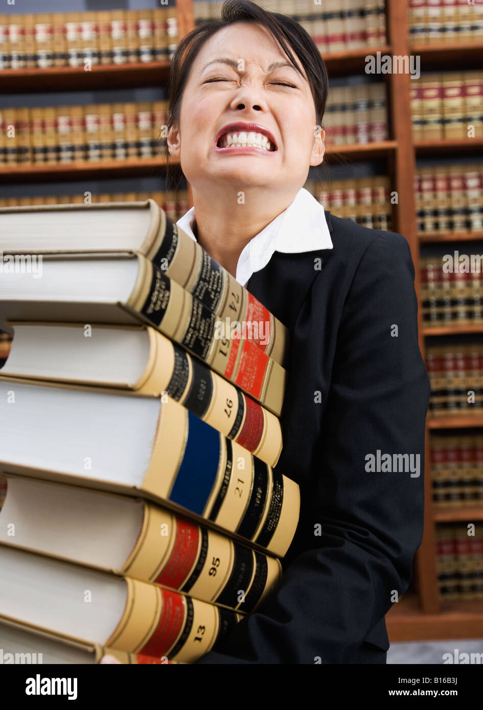 Asian woman carrying stack library hi-res stock photography and images ...
