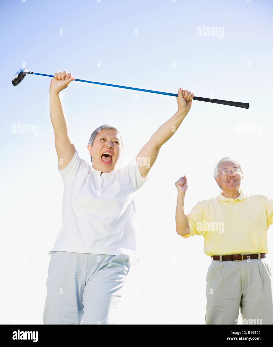 Woman golf club cheering hi-res stock photography and images - Alamy