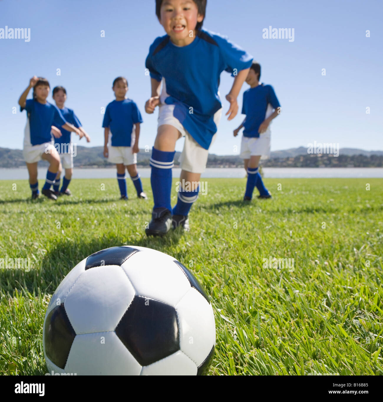 Hispanic children playing soccer hi-res stock photography and images ...