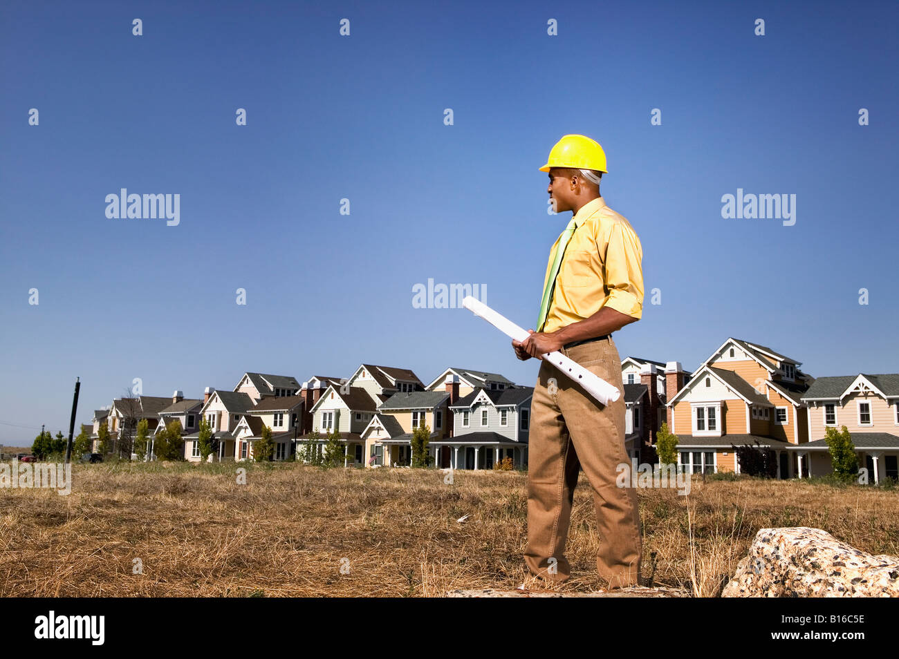 African American businessman holding blueprints Stock Photo - Alamy African American businessman holding blueprints Stock Photo - Alamy