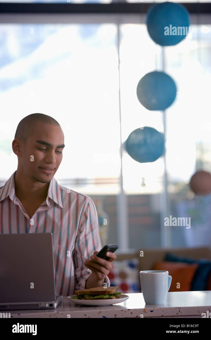 African American man dialing cell phone Stock Photo - Alamy